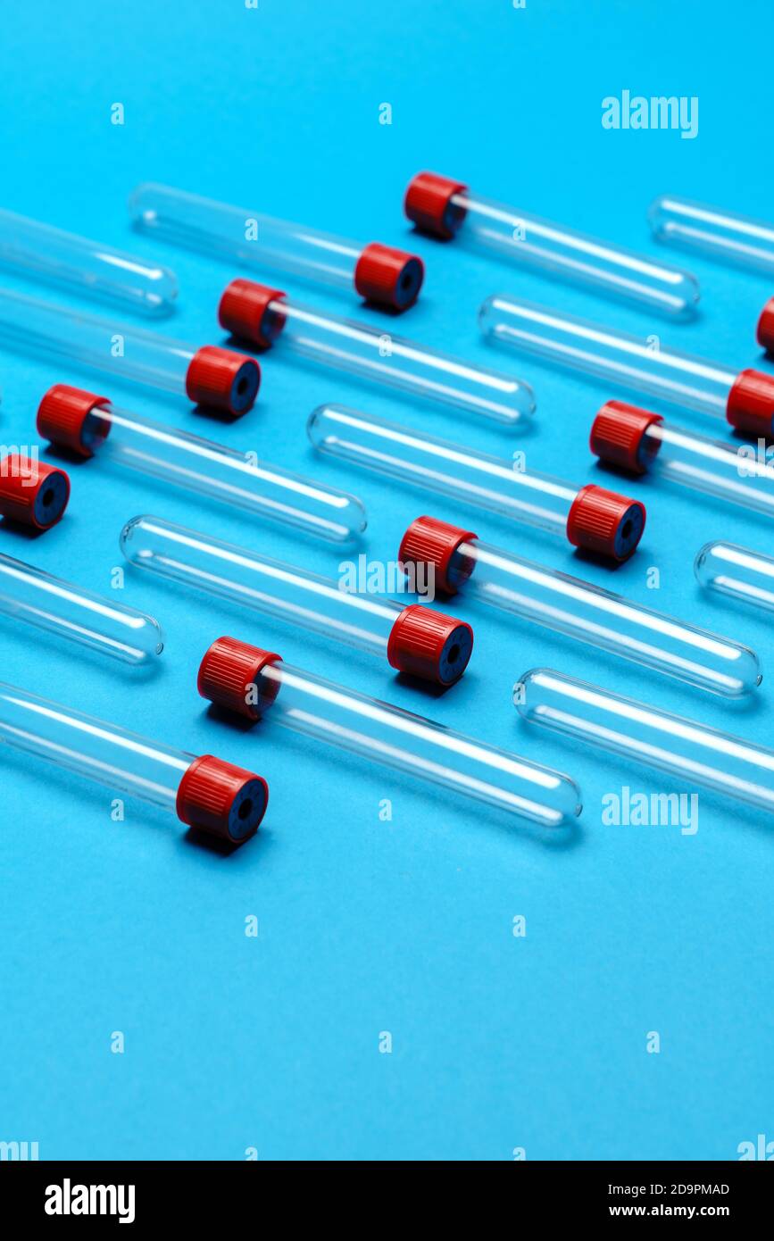 top view of medicine test tubes for blood samples over blue background ...