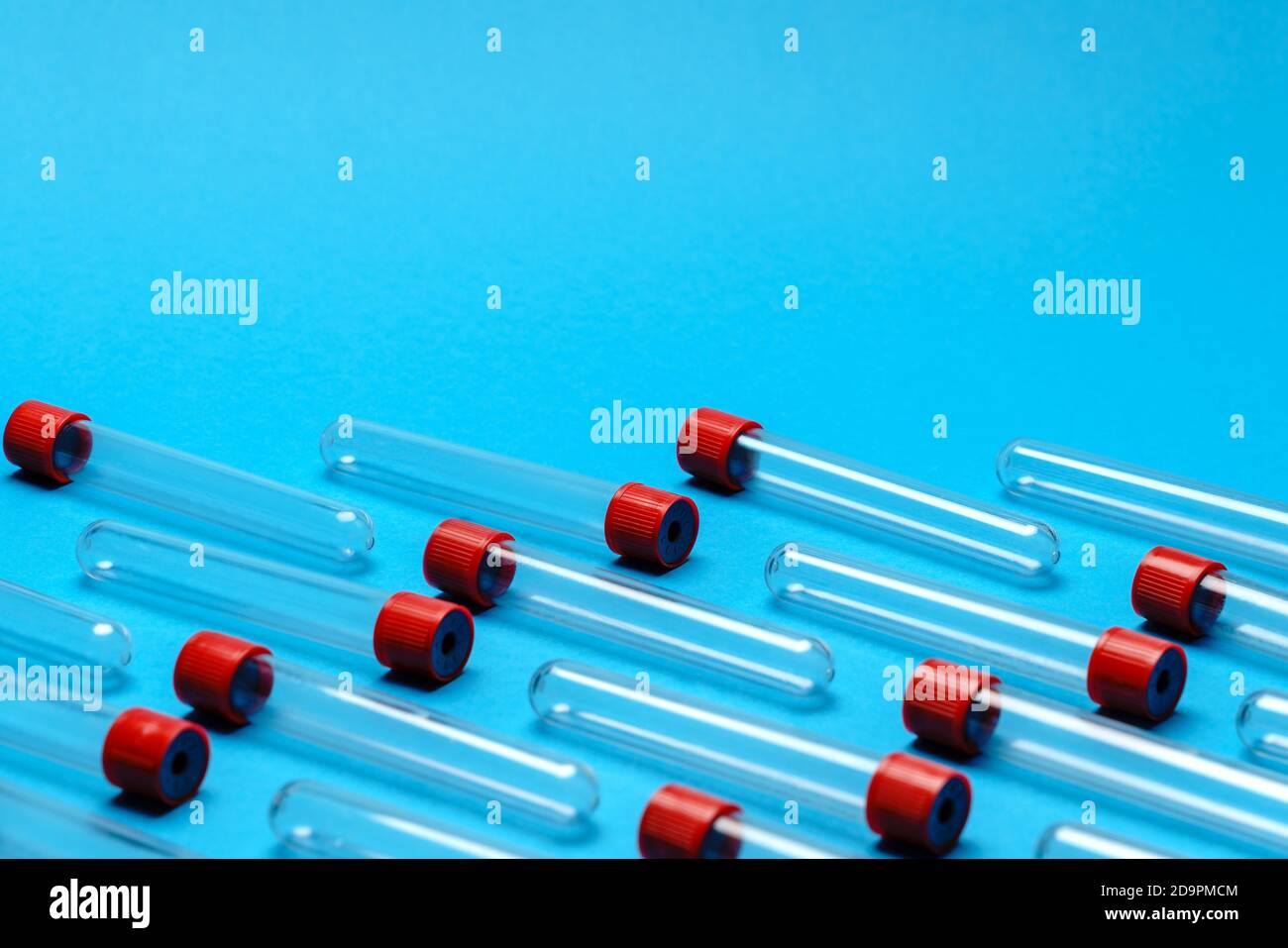 top view of medicine test tubes for blood samples over blue background ...
