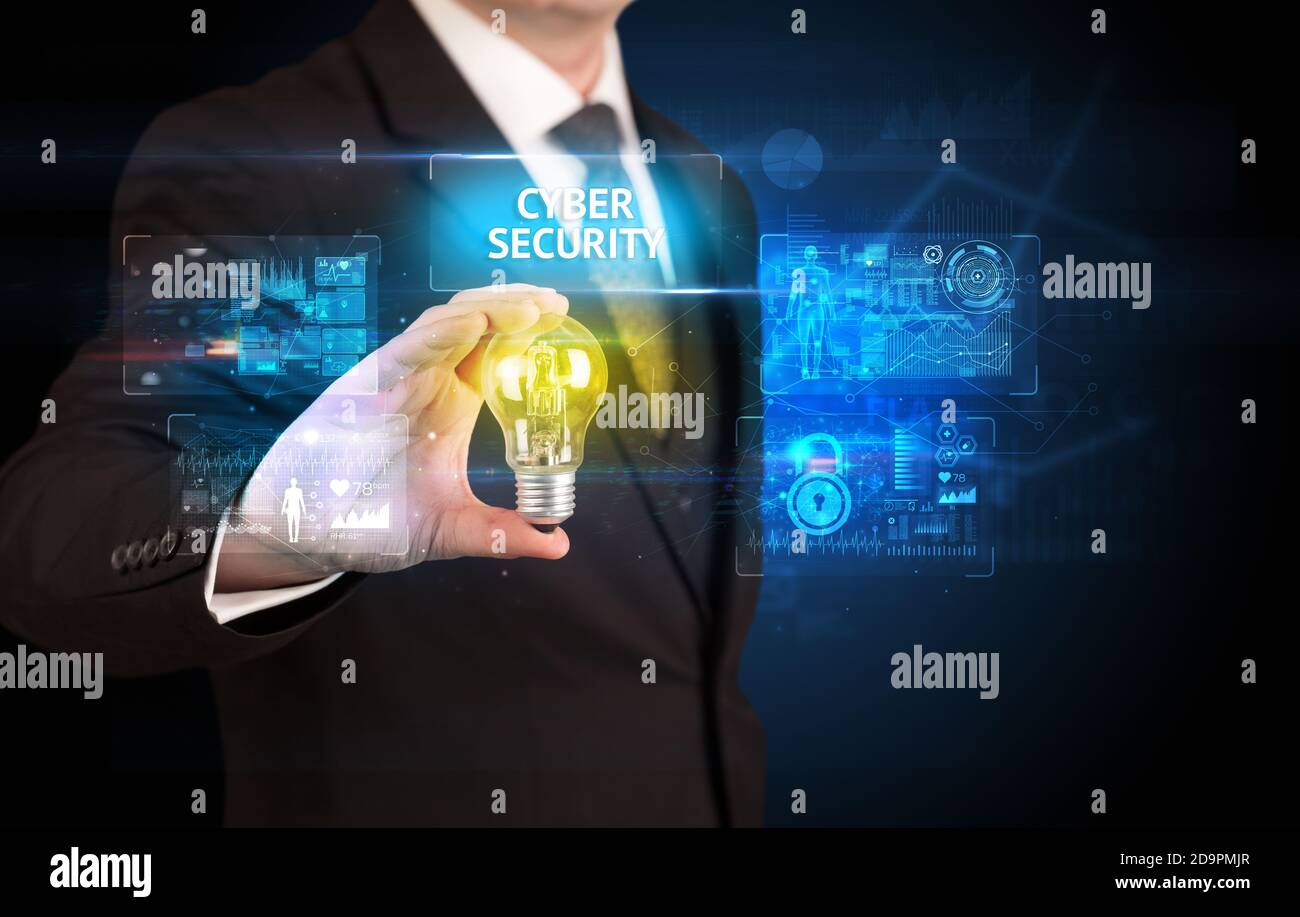 Businessman holding lightbulb with CYBER SECURITY inscription, online ...