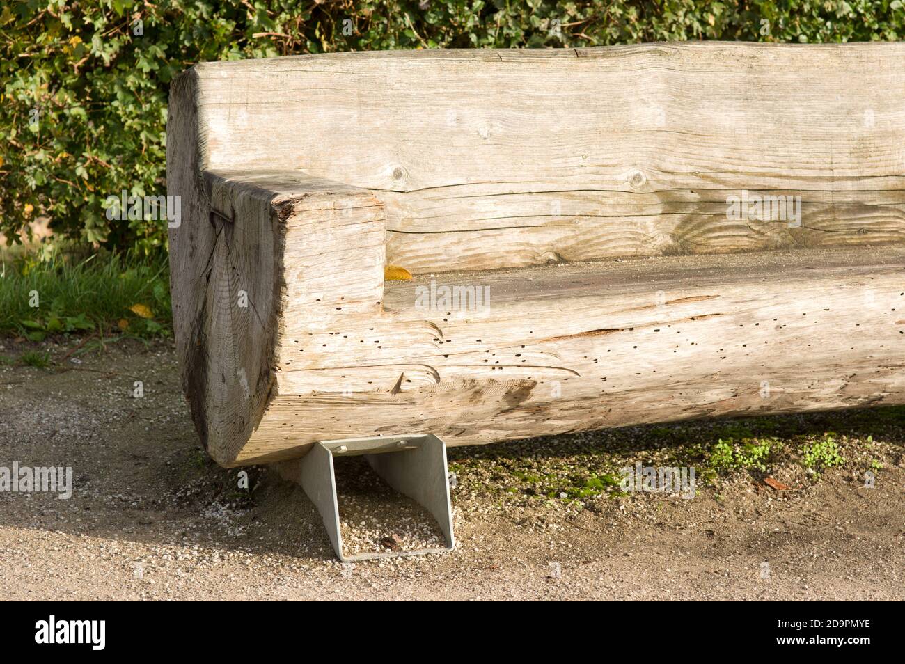 Right side of a brown wooden bench outdoors Stock Photo - Alamy
