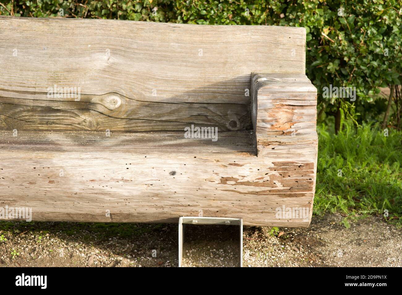 Left side of a brown wooden bench outdoors Stock Photo - Alamy