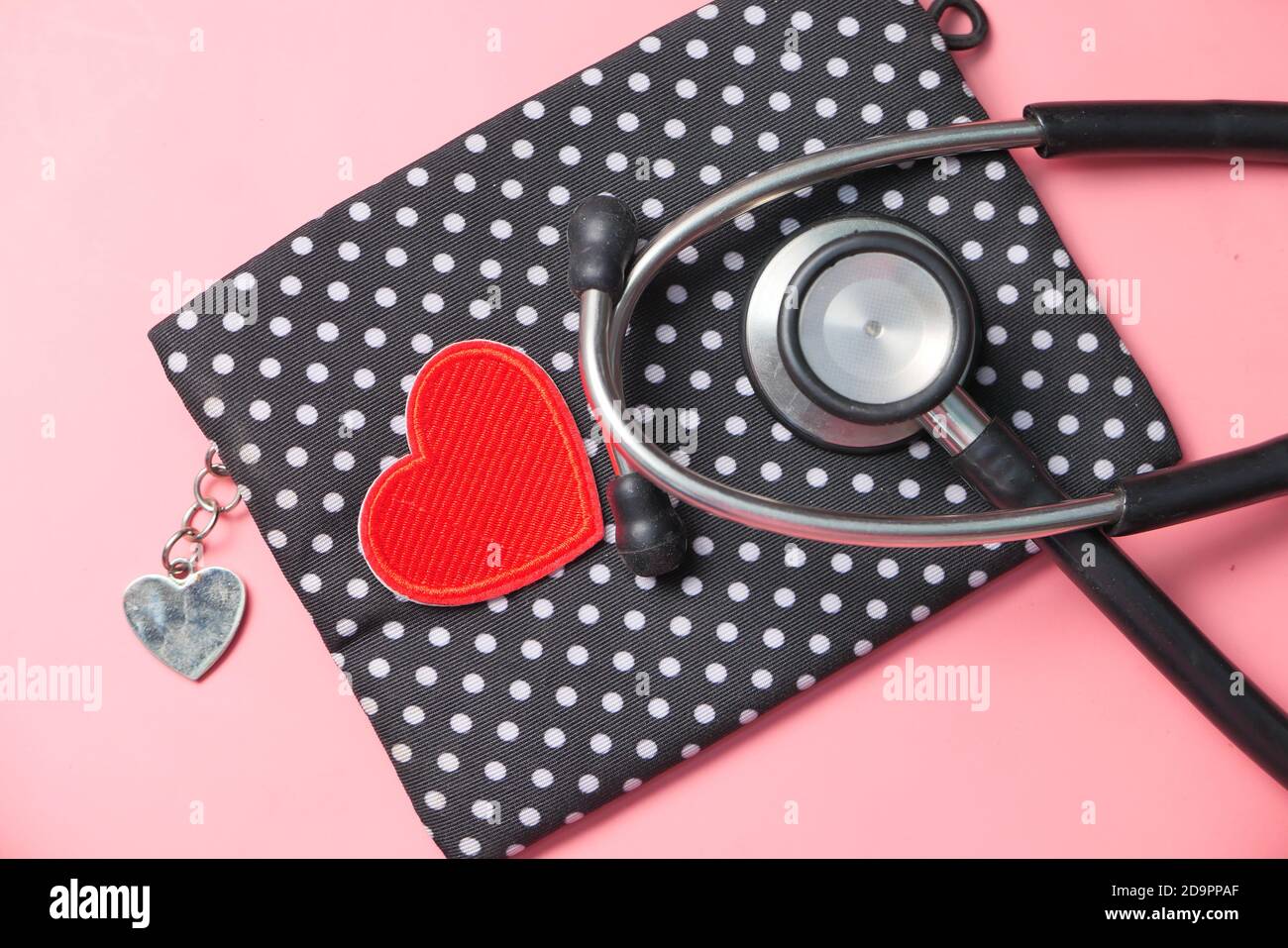 heart shape symbol and stethoscope on pink background Stock Photo - Alamy