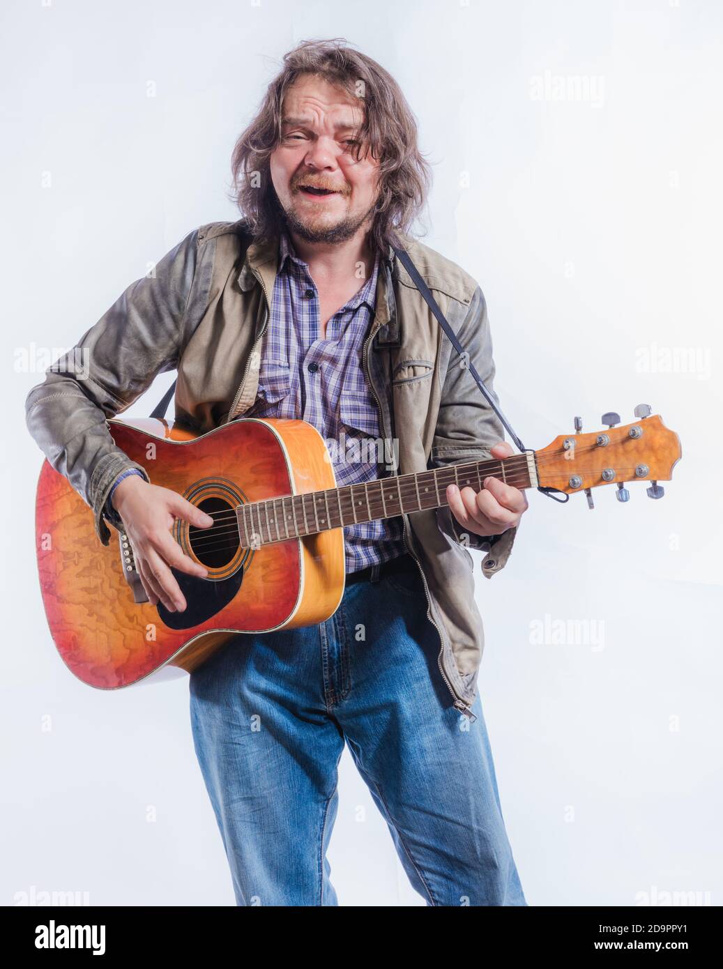 Mature musician plays acoustic guitar studio portrait Stock Photo - Alamy