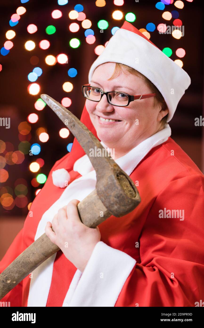 Santa Claus with hammer humor studio portrait with lights on background ...