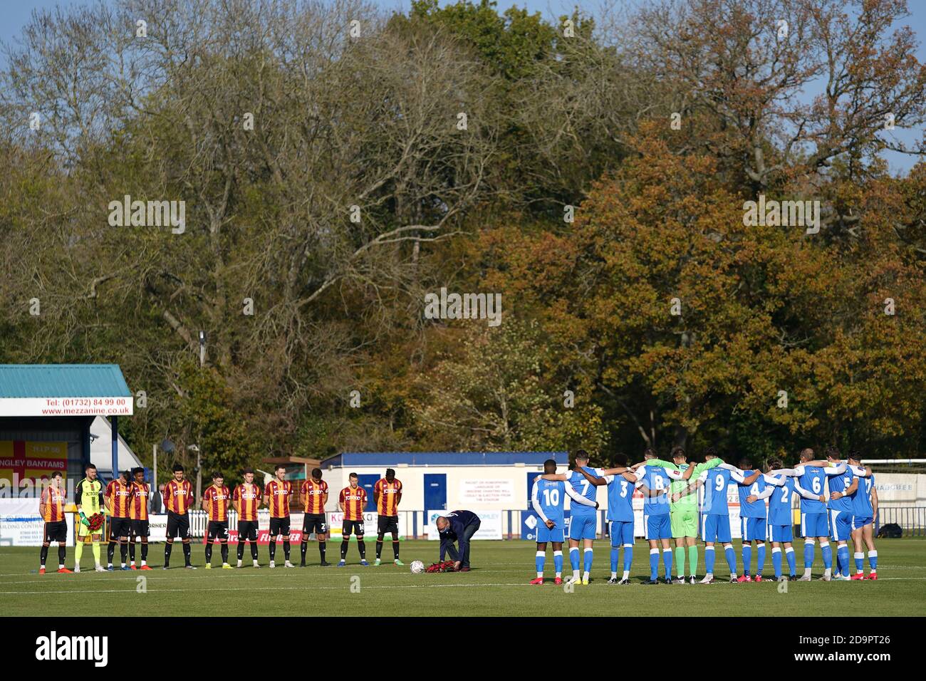 A member of the Tonbridge Angels staff lays a wreath to mark ...