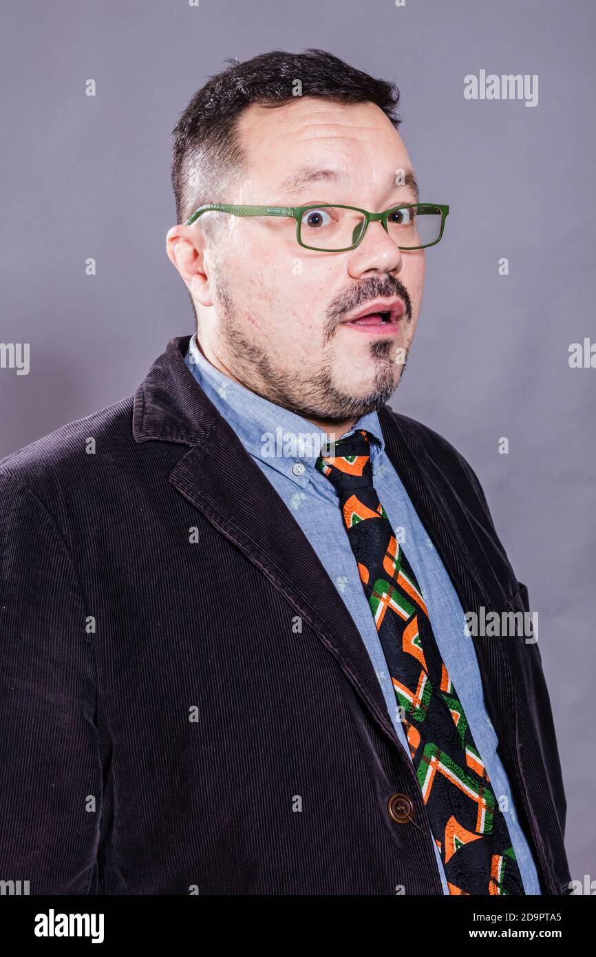 Solid cheerful man in spectacles emotional studio portrait Stock Photo ...