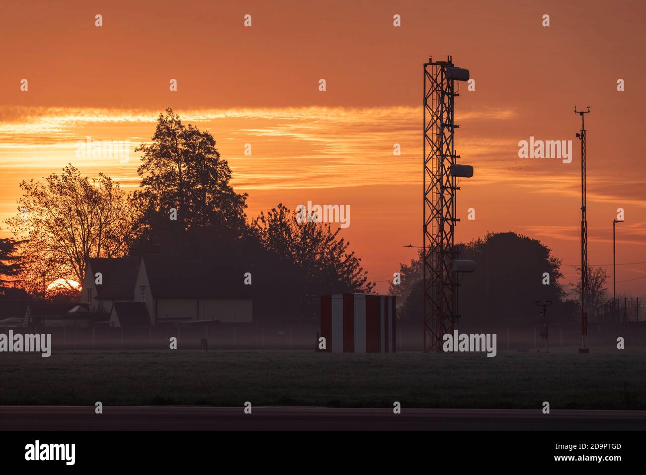 Sunrise at dawn by London Southend Airport, with ILS Glide slope tower ...