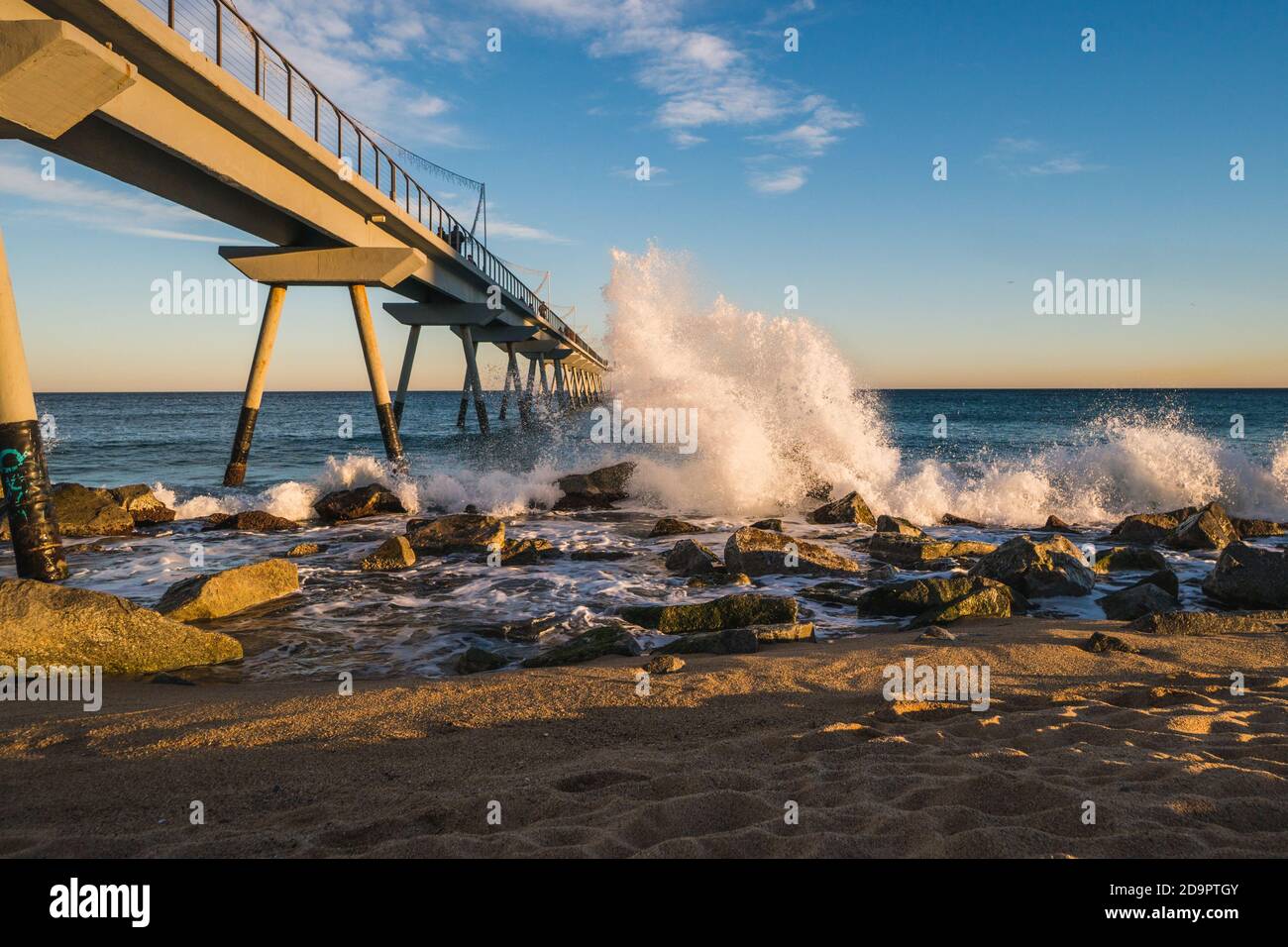 Beautiful pier on Badalona Beach near Barcelona, Spain. Sunset colors ...