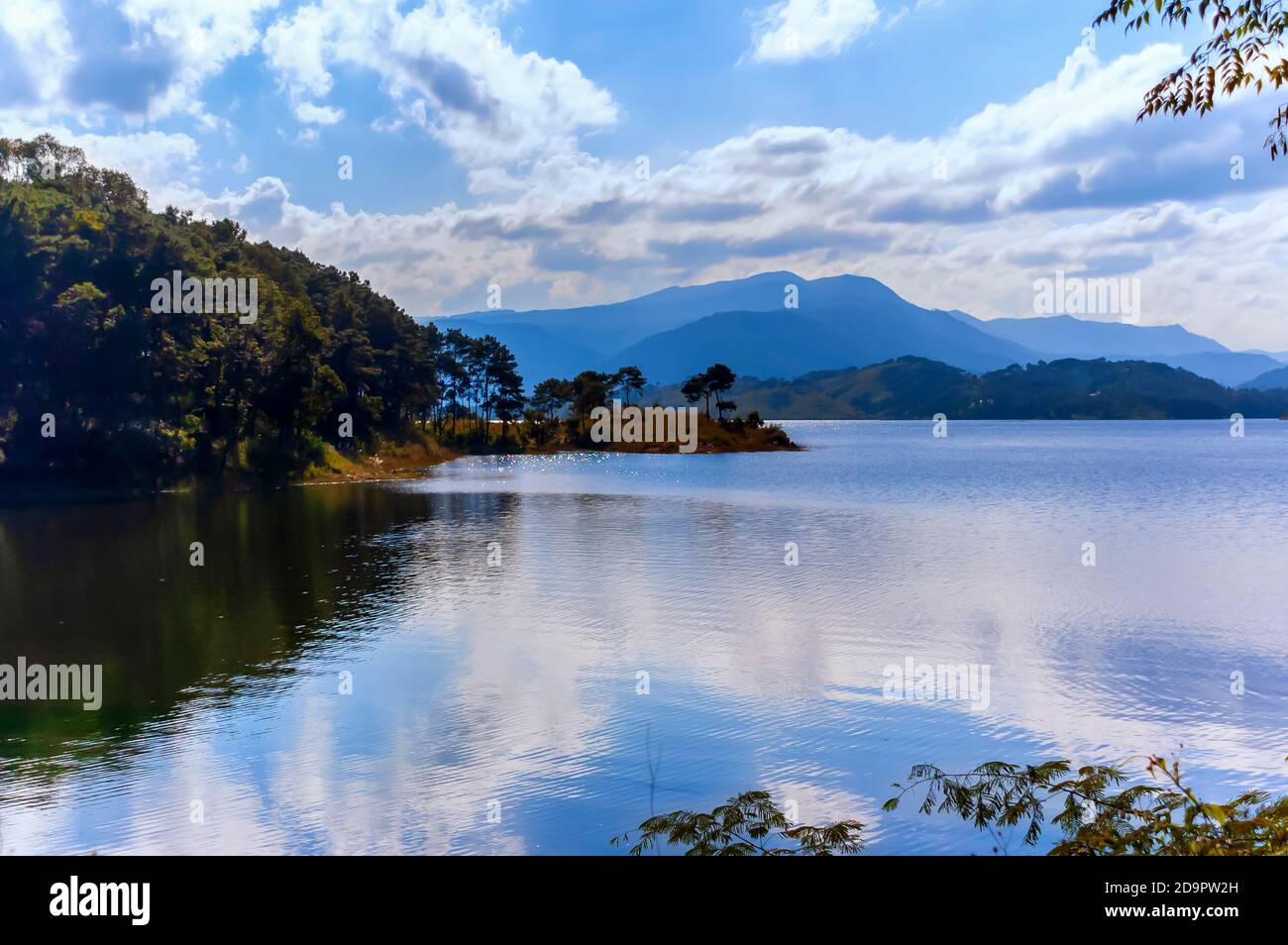 The calm waters of Umiam lake on a winter afternoon. The lake also ...