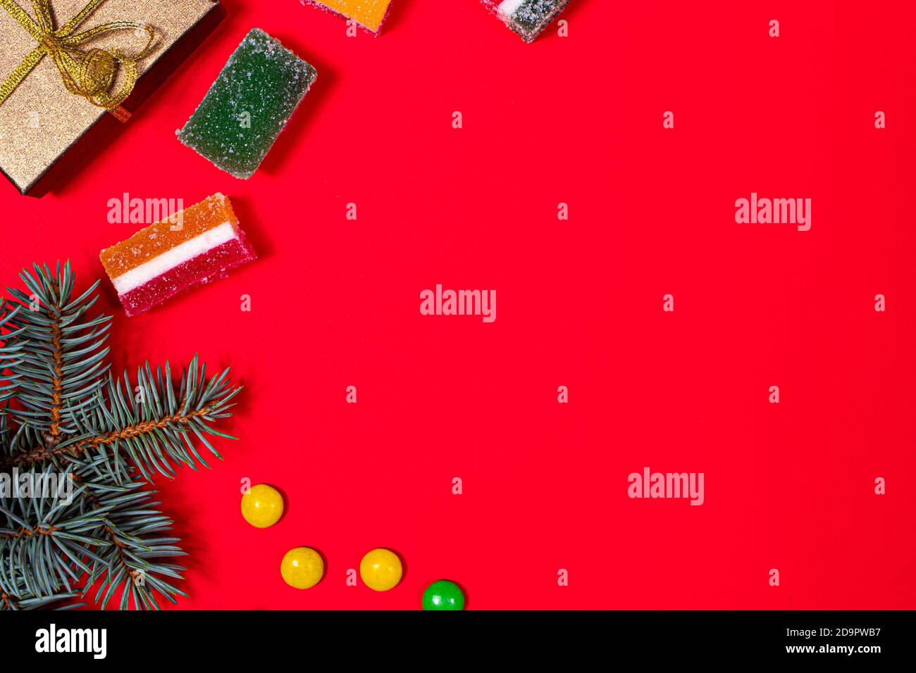 Marmalade candy and lollipops on a red New Year's background. Banner ...