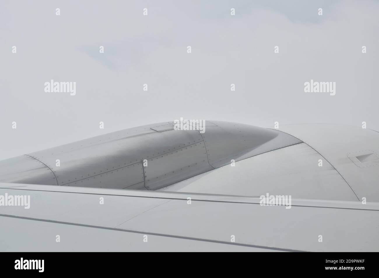 plane wing and cloud floating on sky through window frame Stock Photo ...