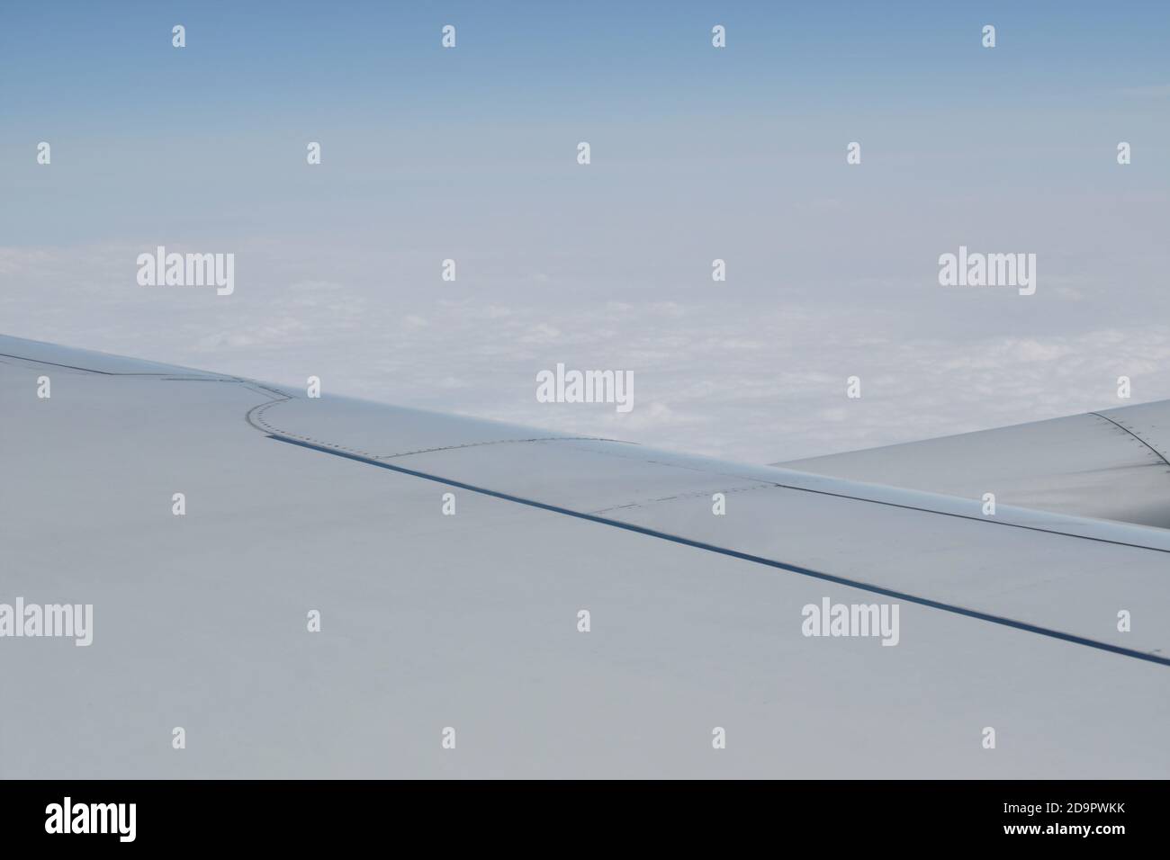 plane wing and cloud floating on sky through window frame Stock Photo ...