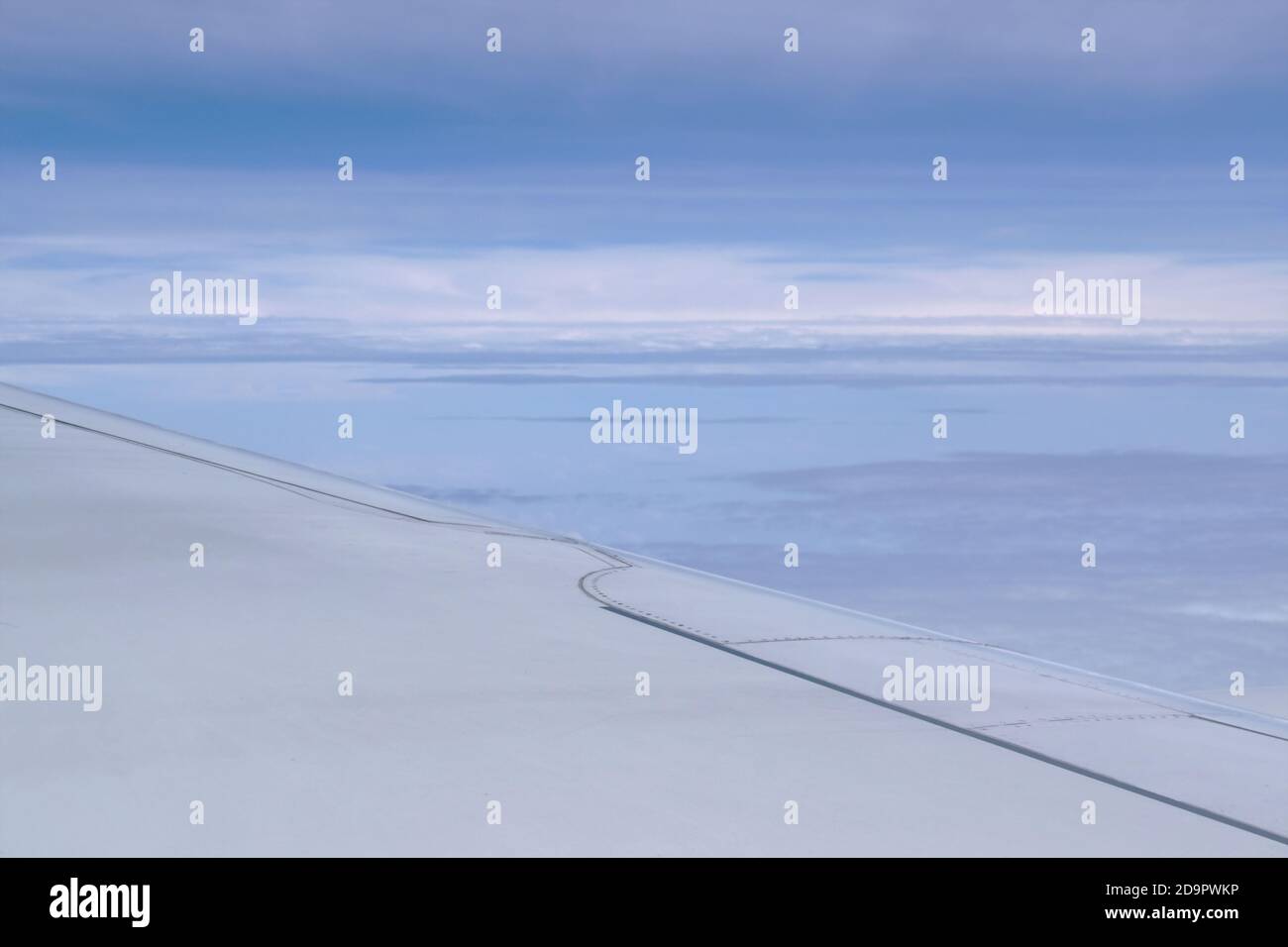 plane wing and cloud floating on sky through window frame Stock Photo ...