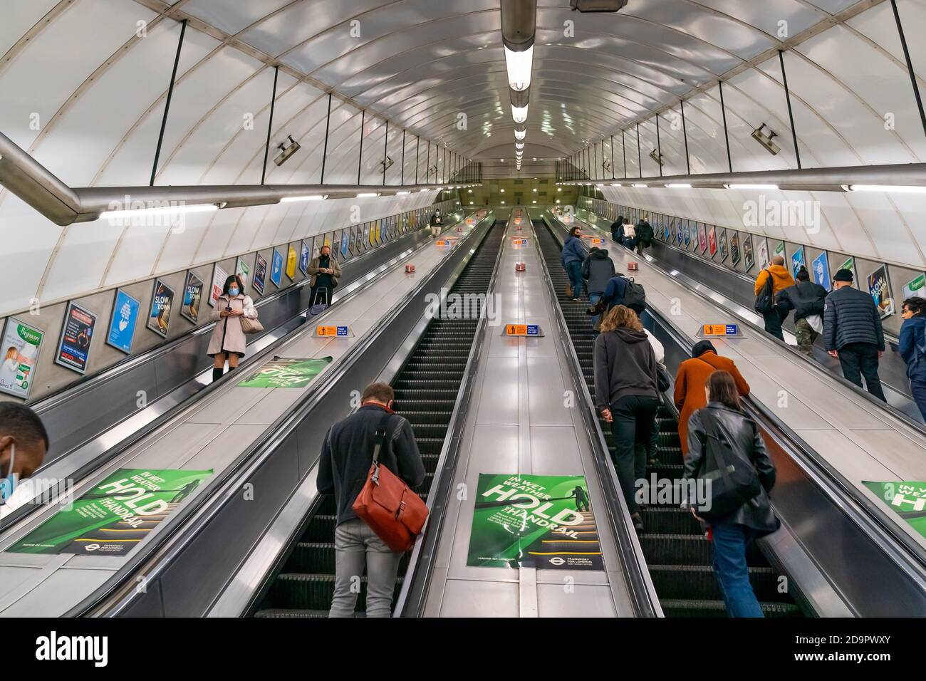 Commuter wearing face mask at piccadilly circus london underground ...
