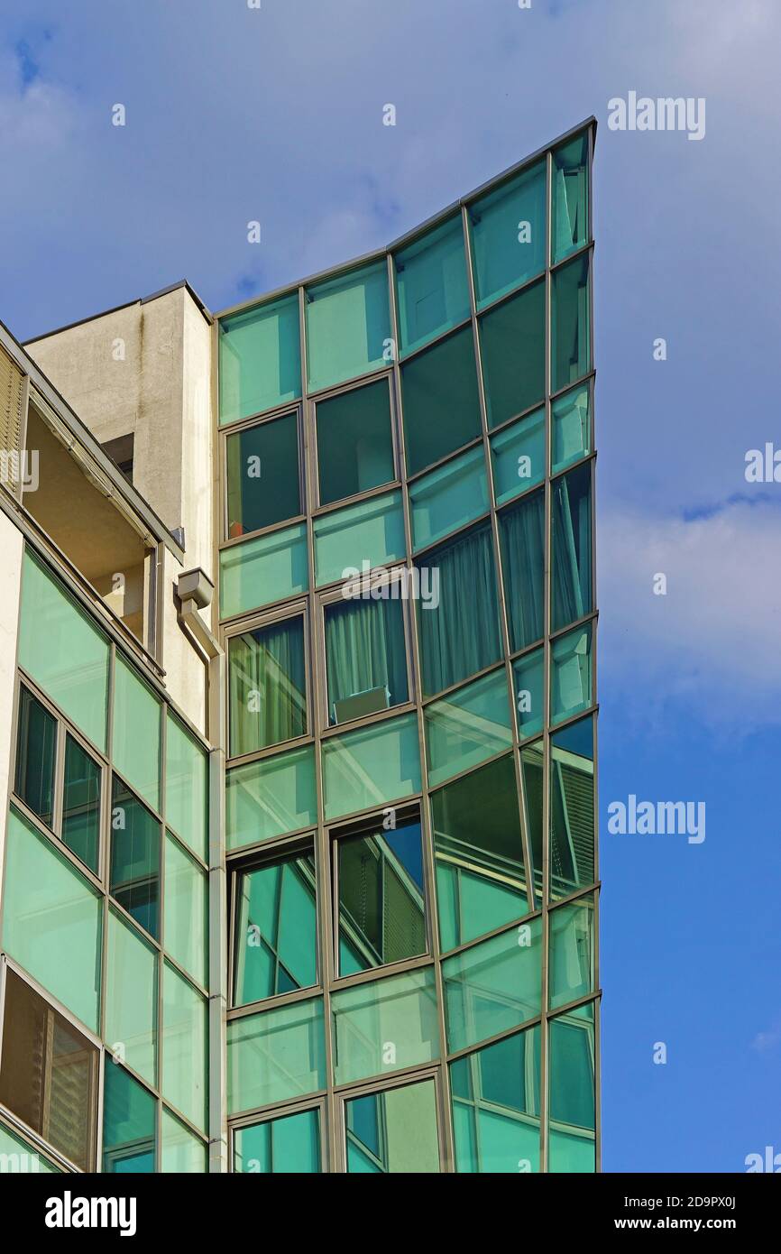 New modern building with green glass windows Stock Photo - Alamy