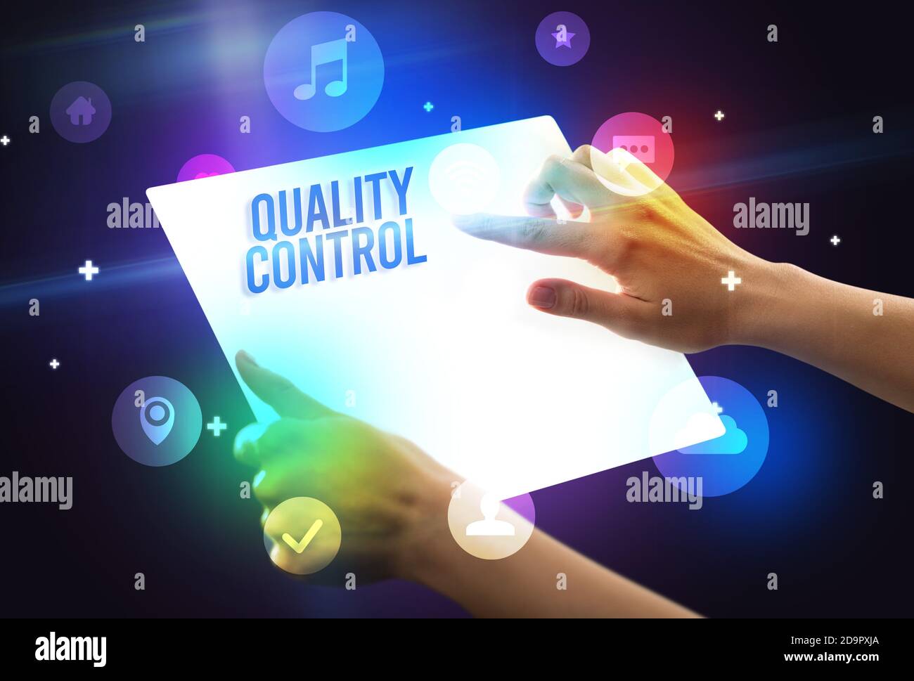 Holding futuristic tablet with QUALITY CONTROL inscription, new ...