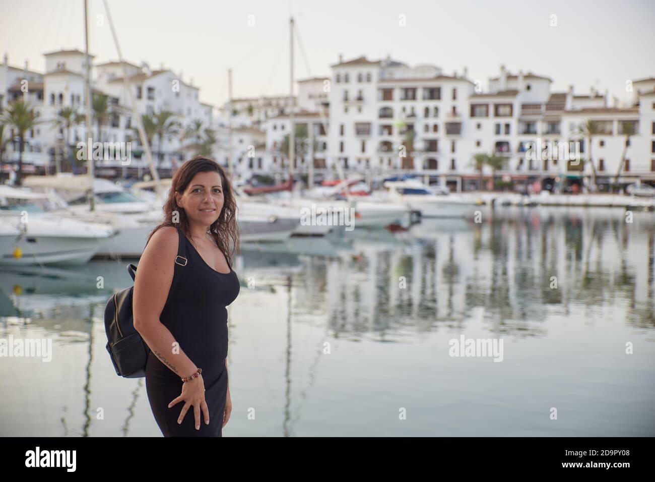 photograph of a woman in a seaport Stock Photo - Alamy