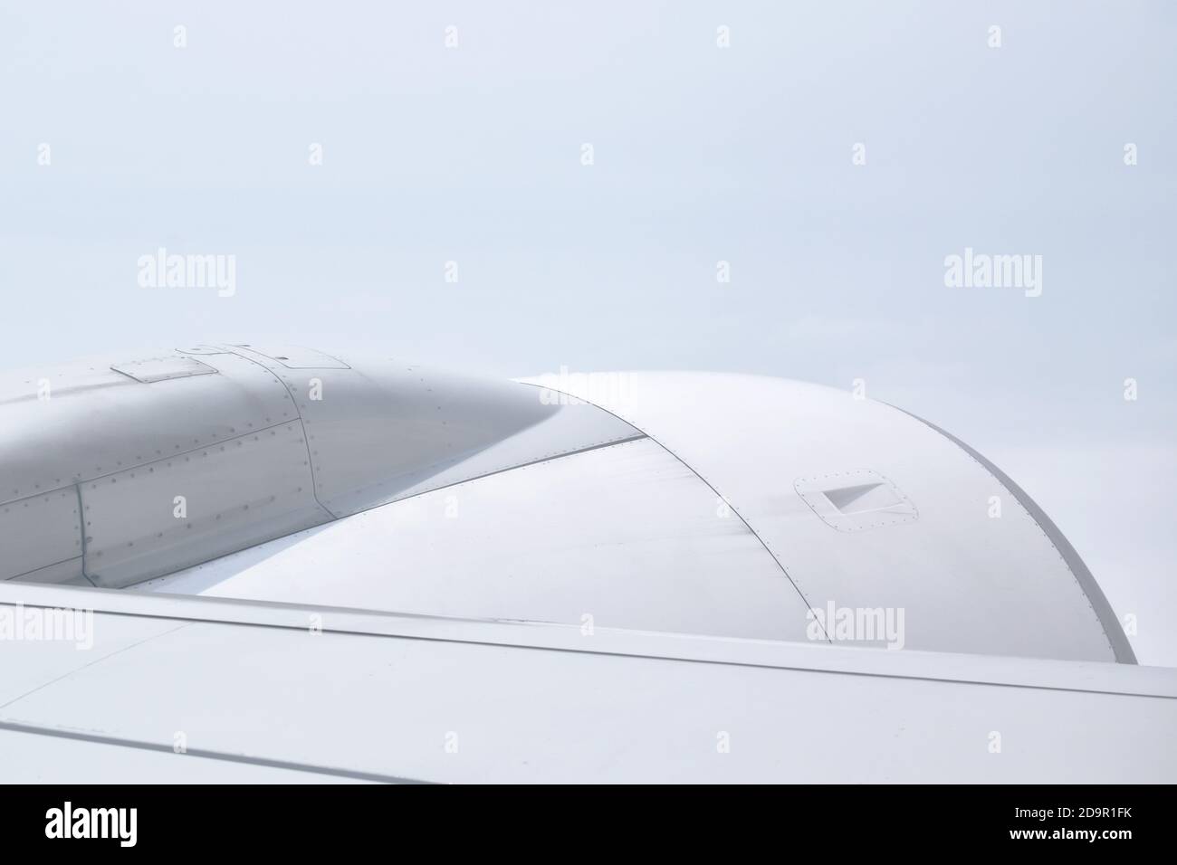 plane wing and cloud floating on sky through window frame Stock Photo ...