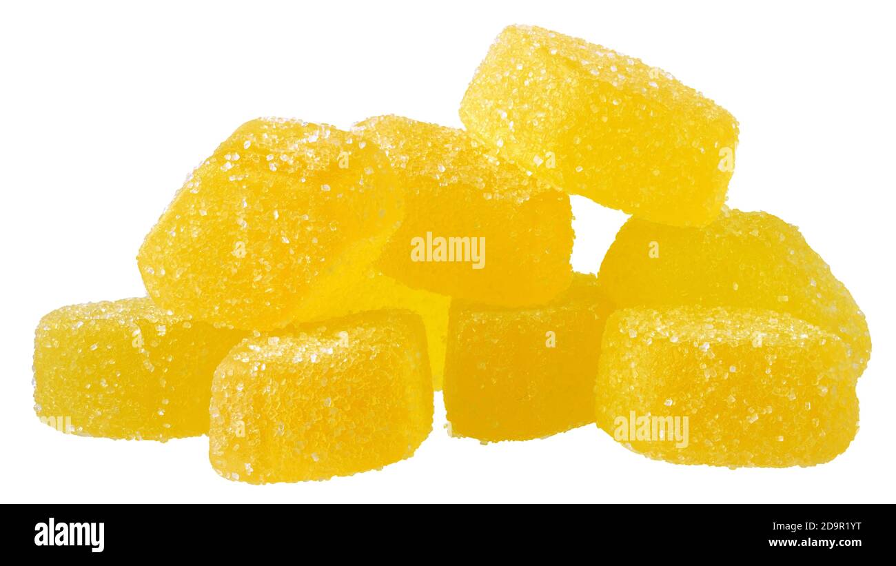 Stack fruit yellow candy close up on a white background Stock Photo - Alamy