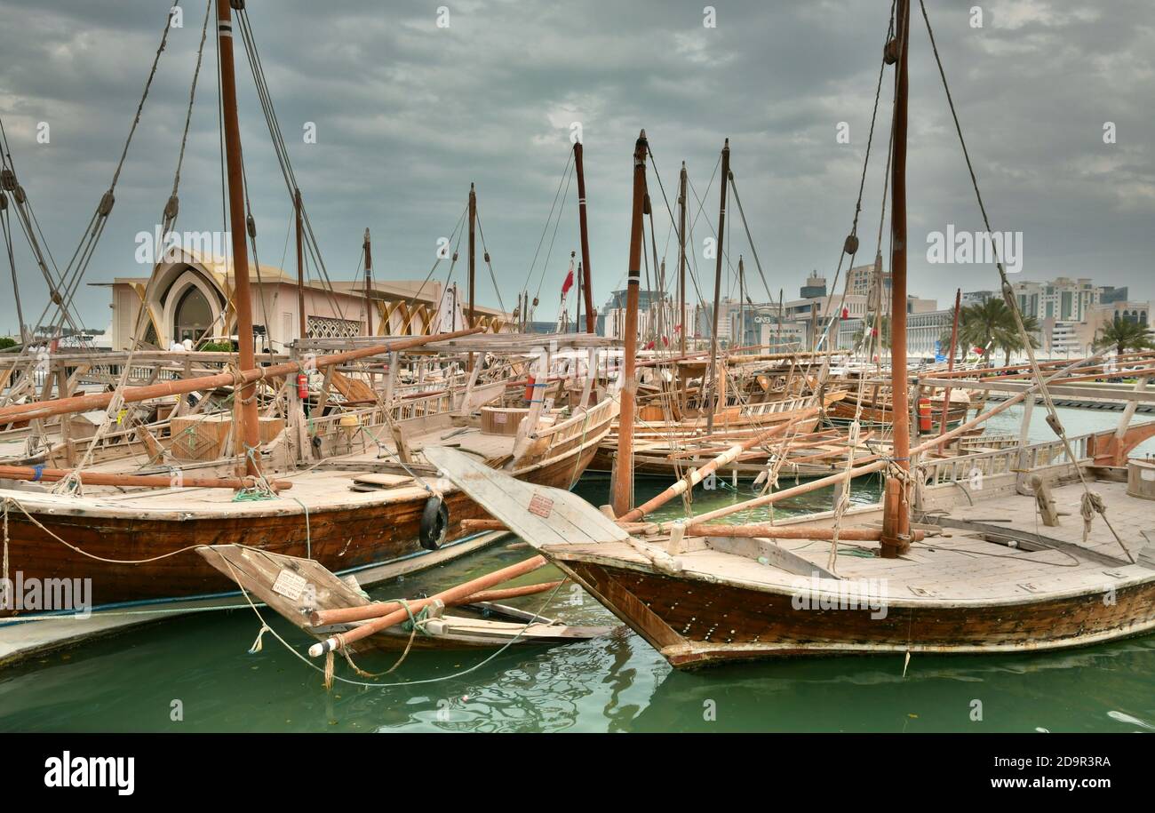 DOHA, QATAR - APRIL 12: Traditional dhow boat in Doha, with buildings ...