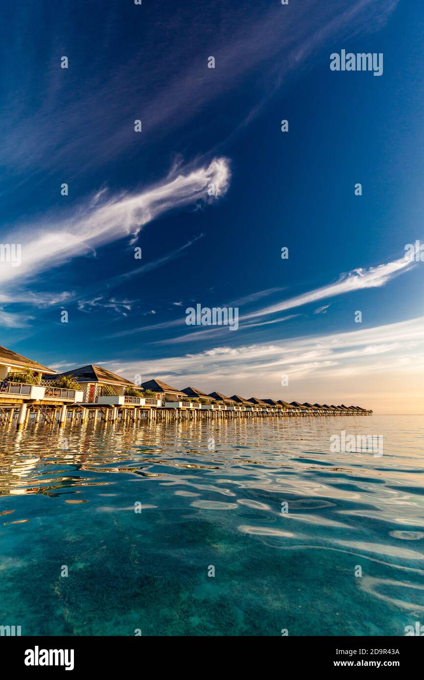 Beautiful summer beach paradise with sandy beach and villas and lagoon ...