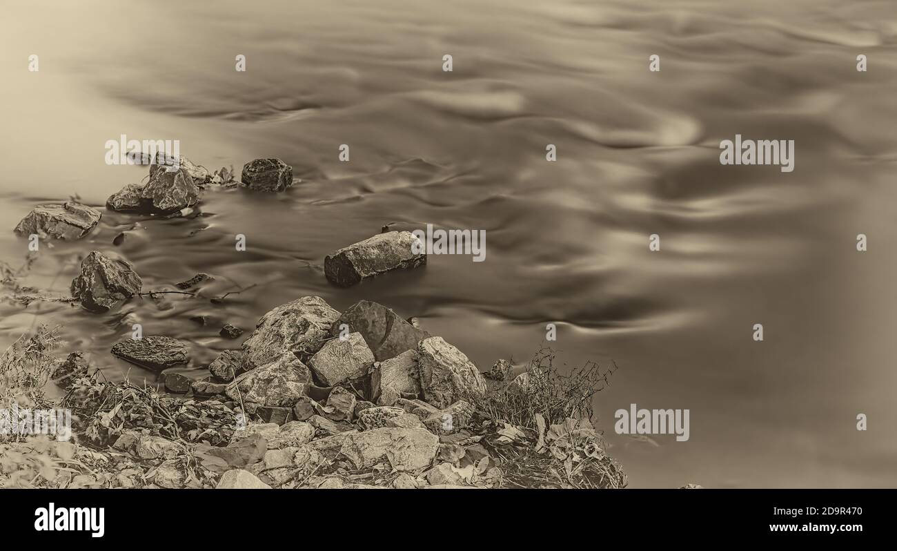 Surreal black and white photo of smooth water swirling around the ...