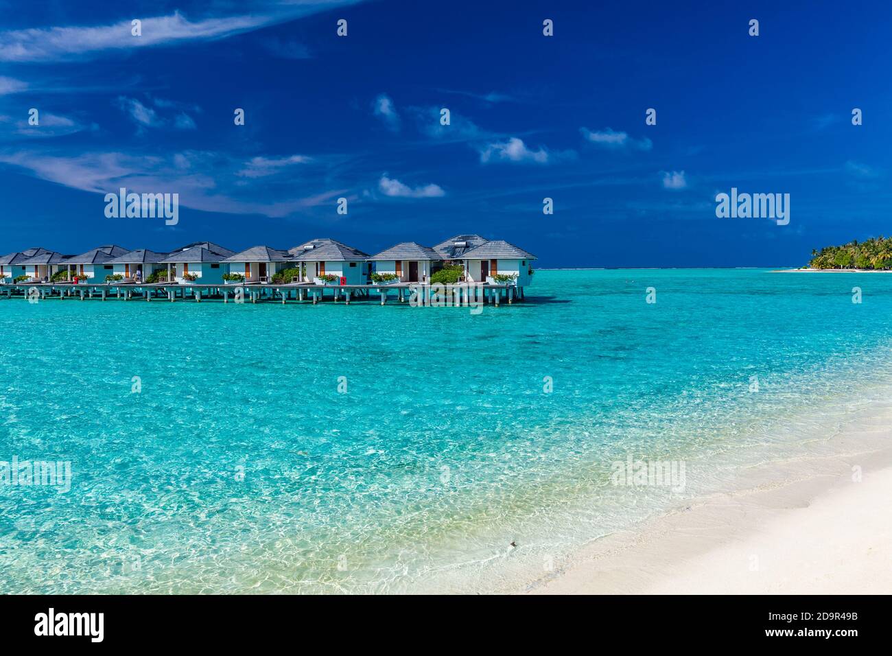 Beautiful summer beach paradise with sandy beach and villas and lagoon ...