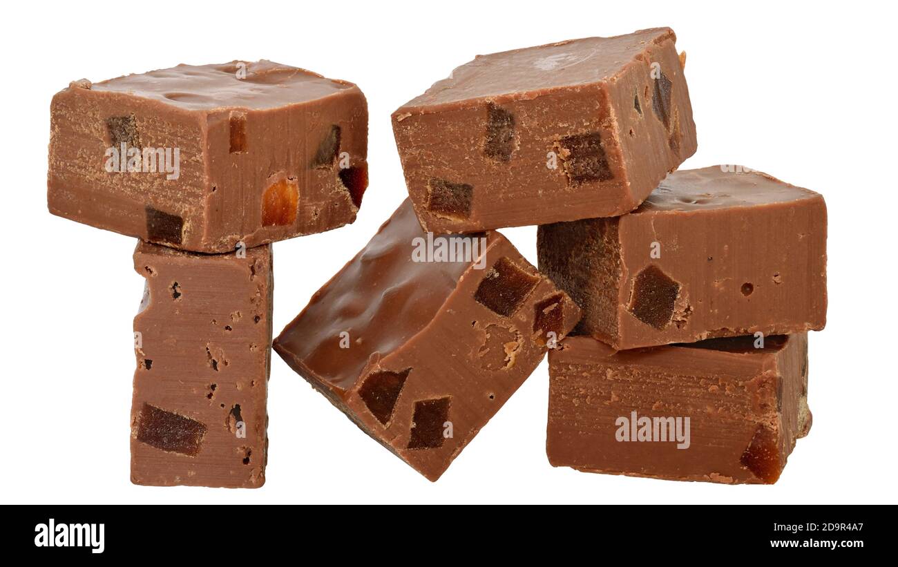 Milk chocolate cubes filled with orange candied fruit isolated on white ...