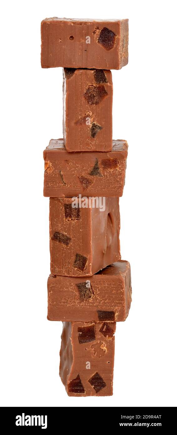 Milk chocolate cubes tower filled with orange candied fruit isolated on ...