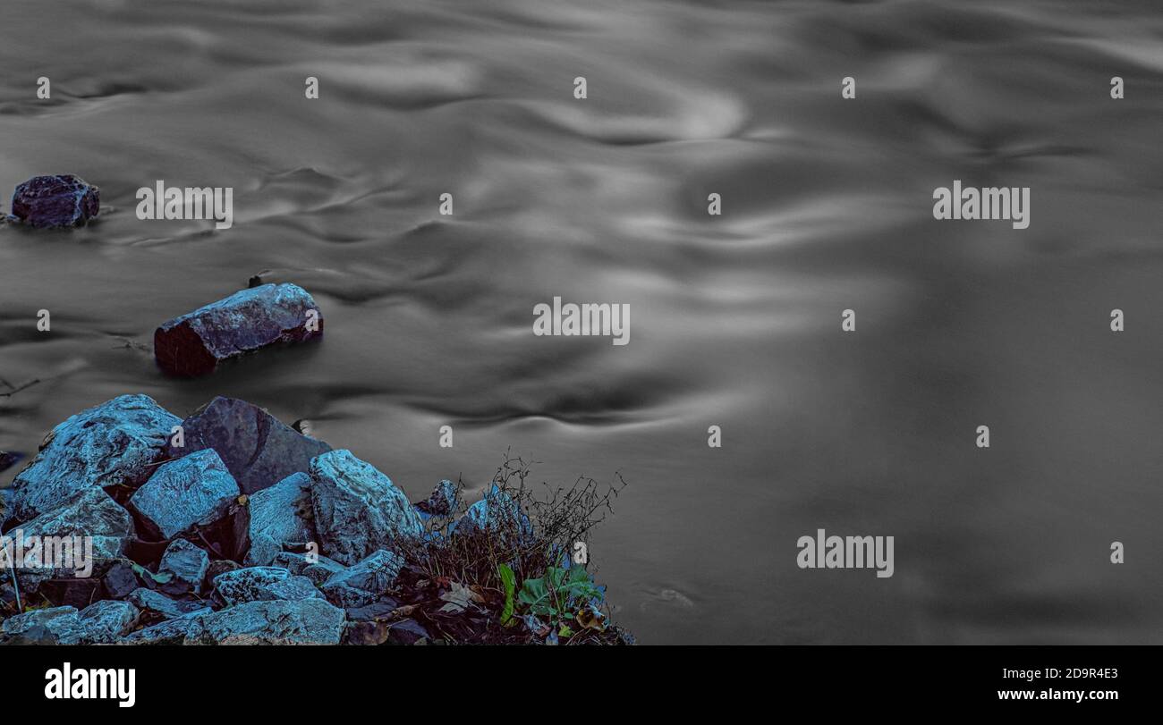 Surreal black and white photo of smooth water swirling around the ...