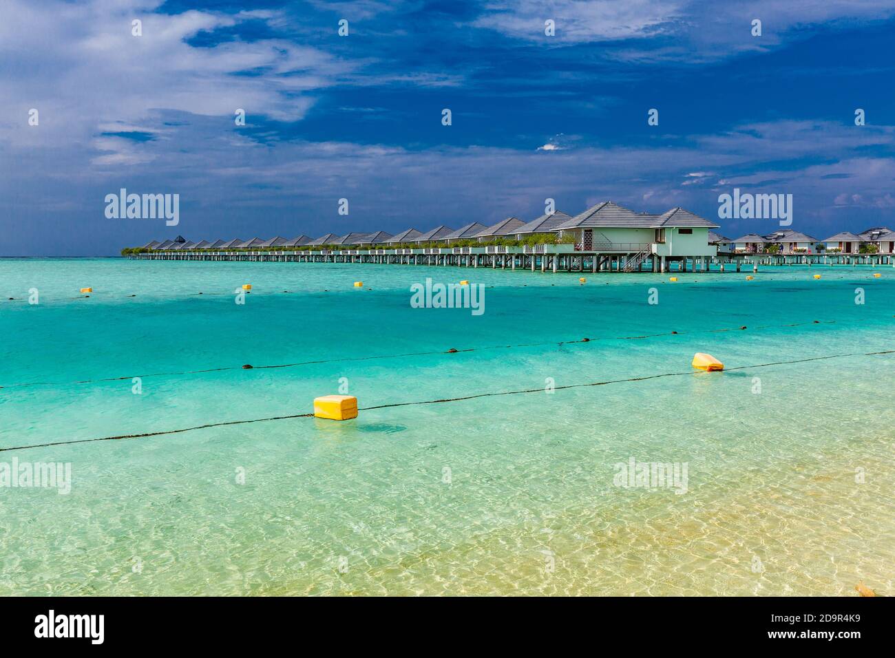 Beautiful summer beach paradise with sandy beach and villas and lagoon ...