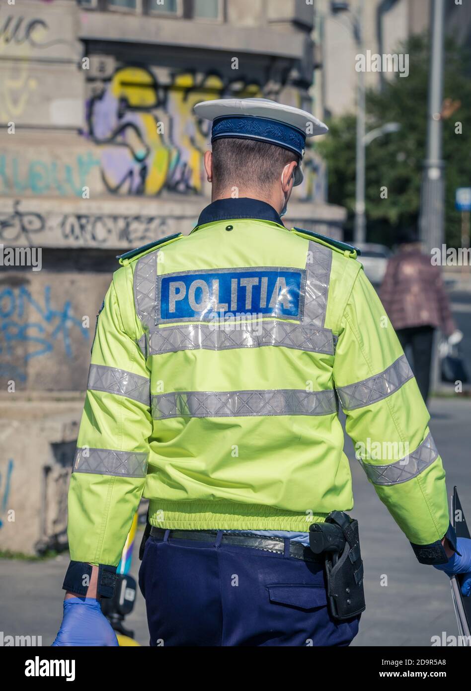Bucharest/Romania - 10.17.2020: Rear view of a romanian police officer ...