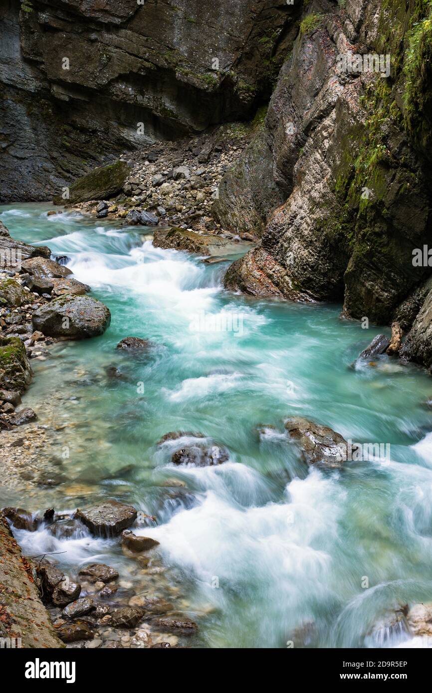 Clean, beautiful, mountain river flows through a rocky gorge ...