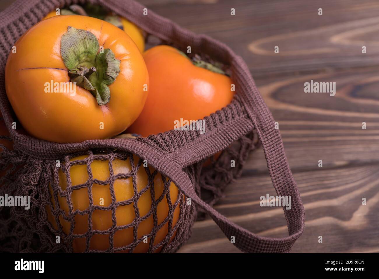 Persimmon on a string hi-res stock photography and images - Alamy