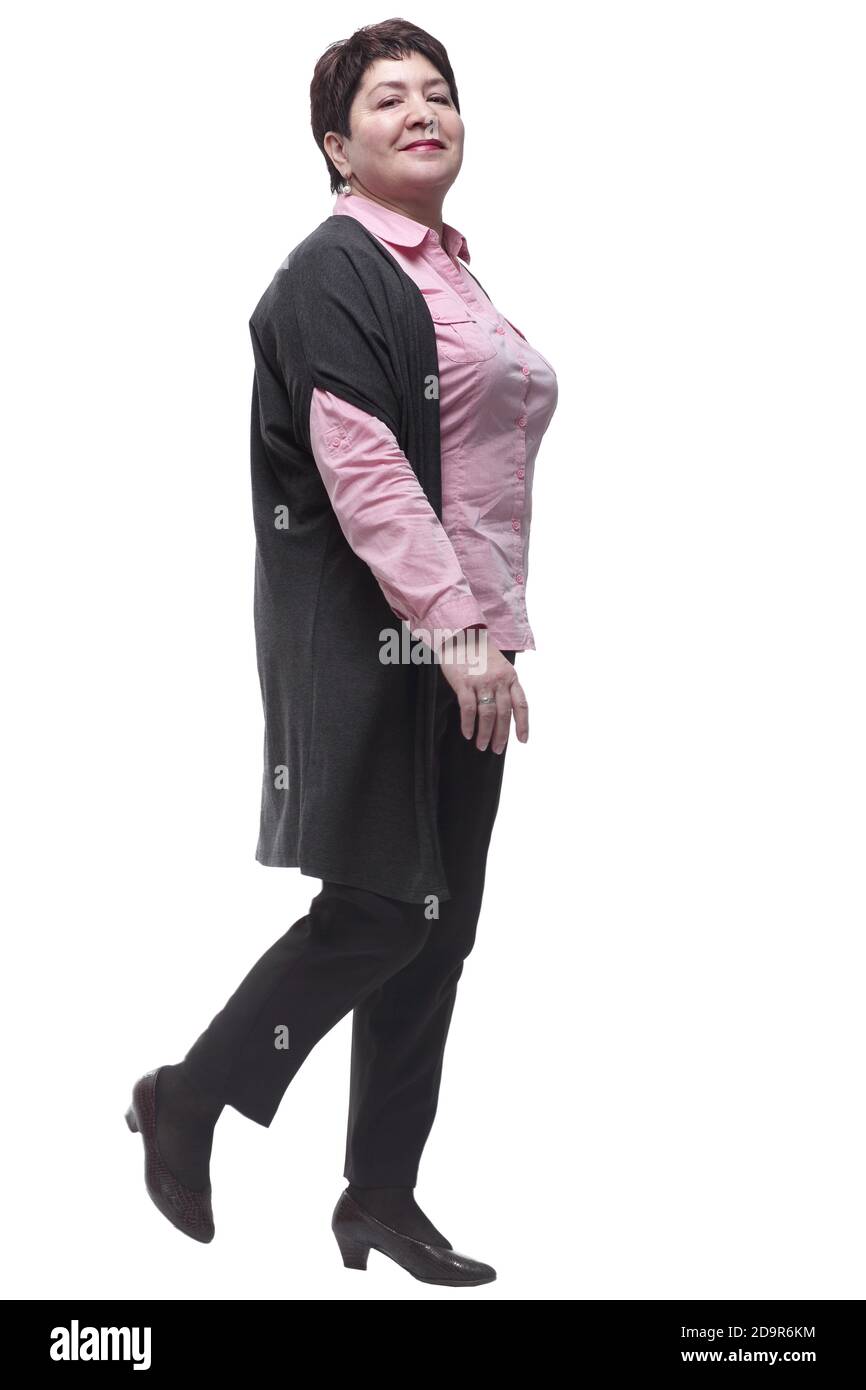 side view . confident adult woman striding forward Stock Photo - Alamy