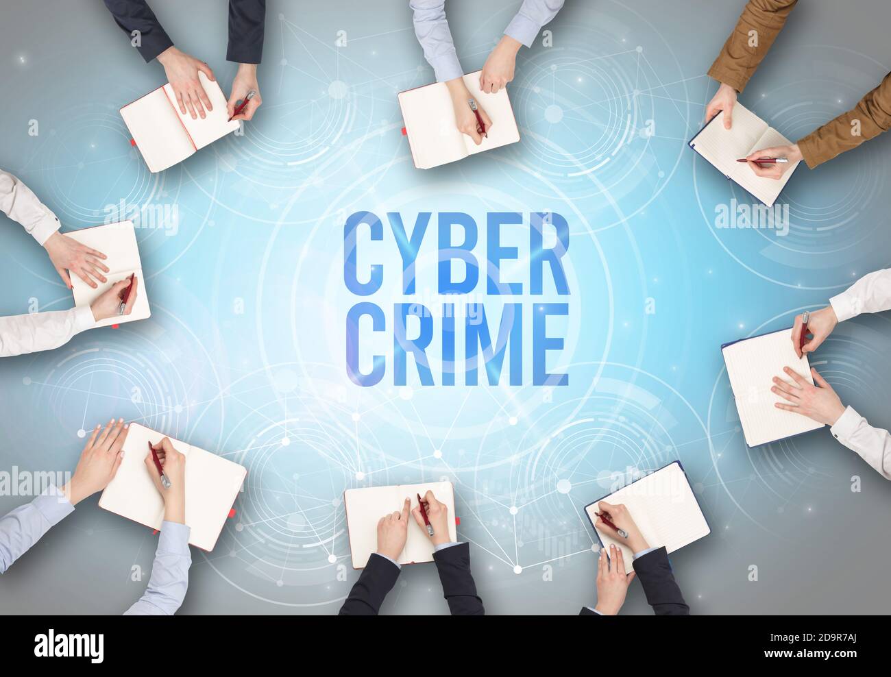 Group of people in front of a laptop with CYBER CRIME insciption, web ...