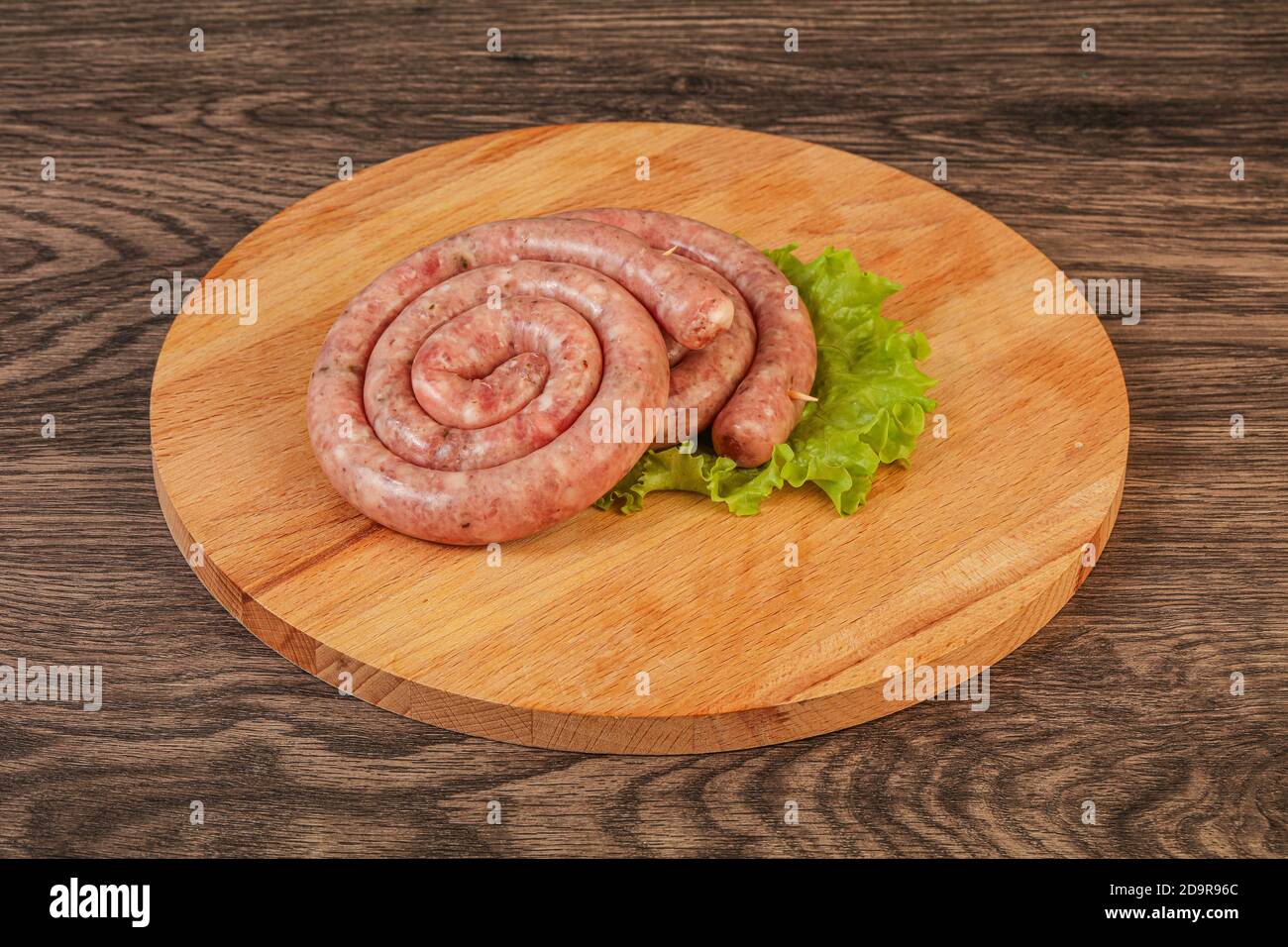 Raw pork sausage ring for grill Stock Photo - Alamy