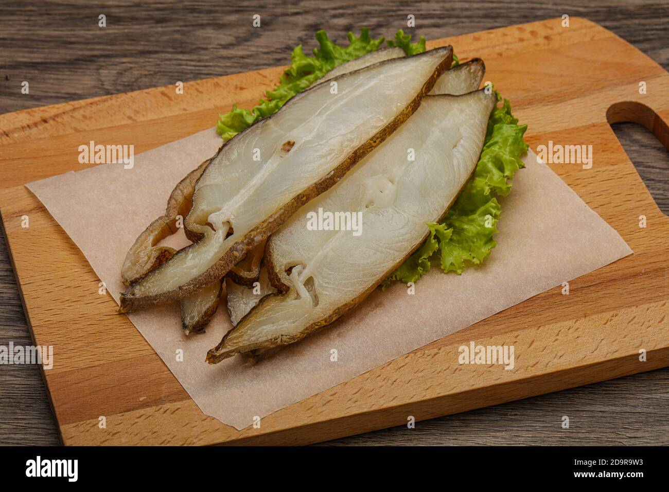 Delicous smoked halibut fish slices snack Stock Photo - Alamy
