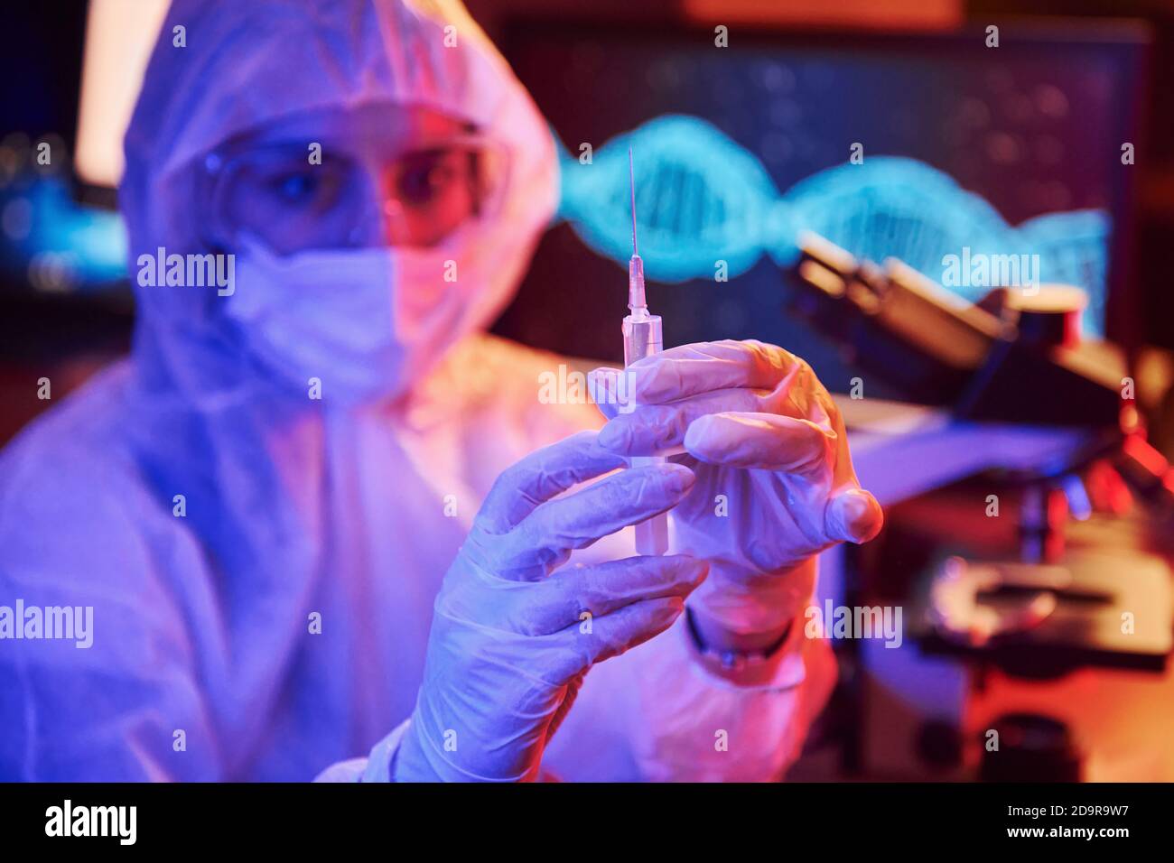 Nurse in mask and white uniform, holding syringe and sitting in neon ...