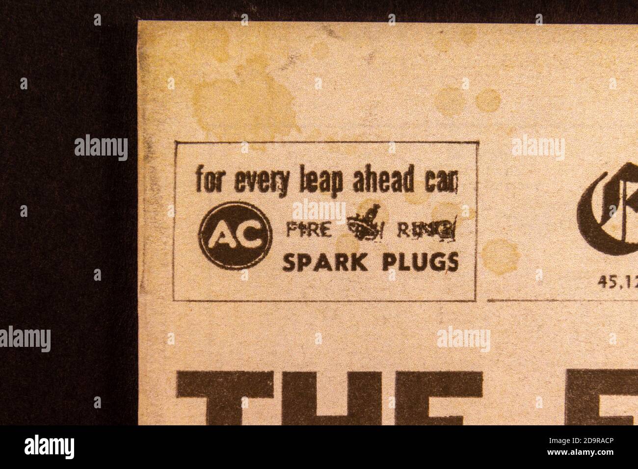 Advert for AC spark plugs inside an Evening Standard souvenir newspaper ...
