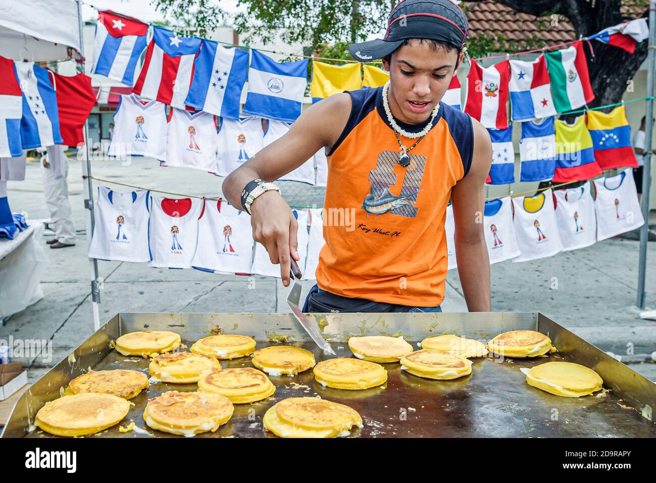 Cook cooking arepas food vendor stall booth hi-res stock photography ...
