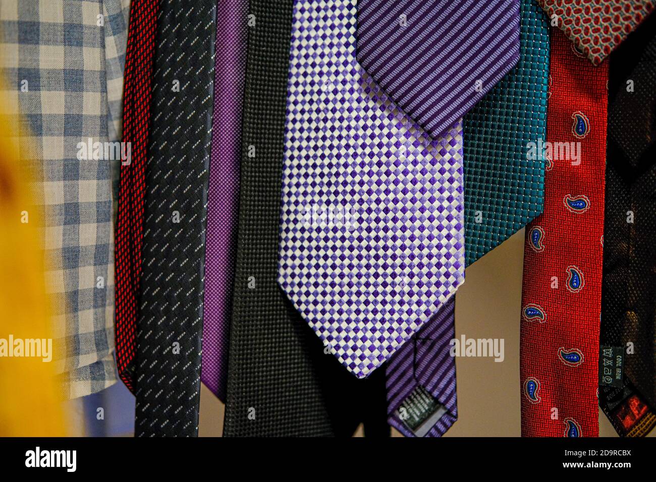 Collection of Ties hanging in a wardrobe Stock Photo - Alamy