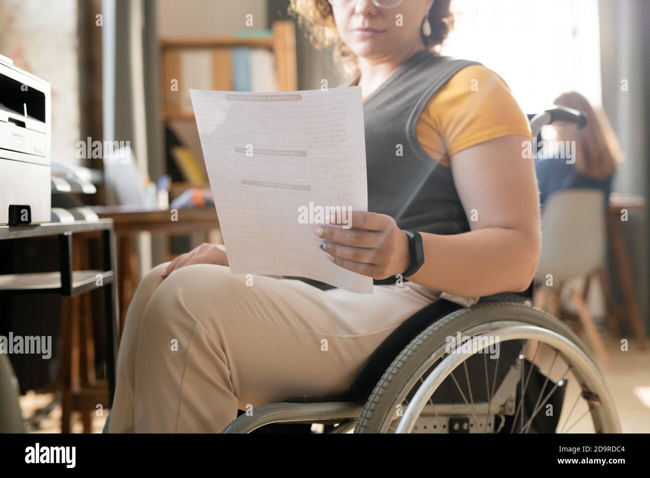 Hand of young contemporary businesswoman reading paper before making ...