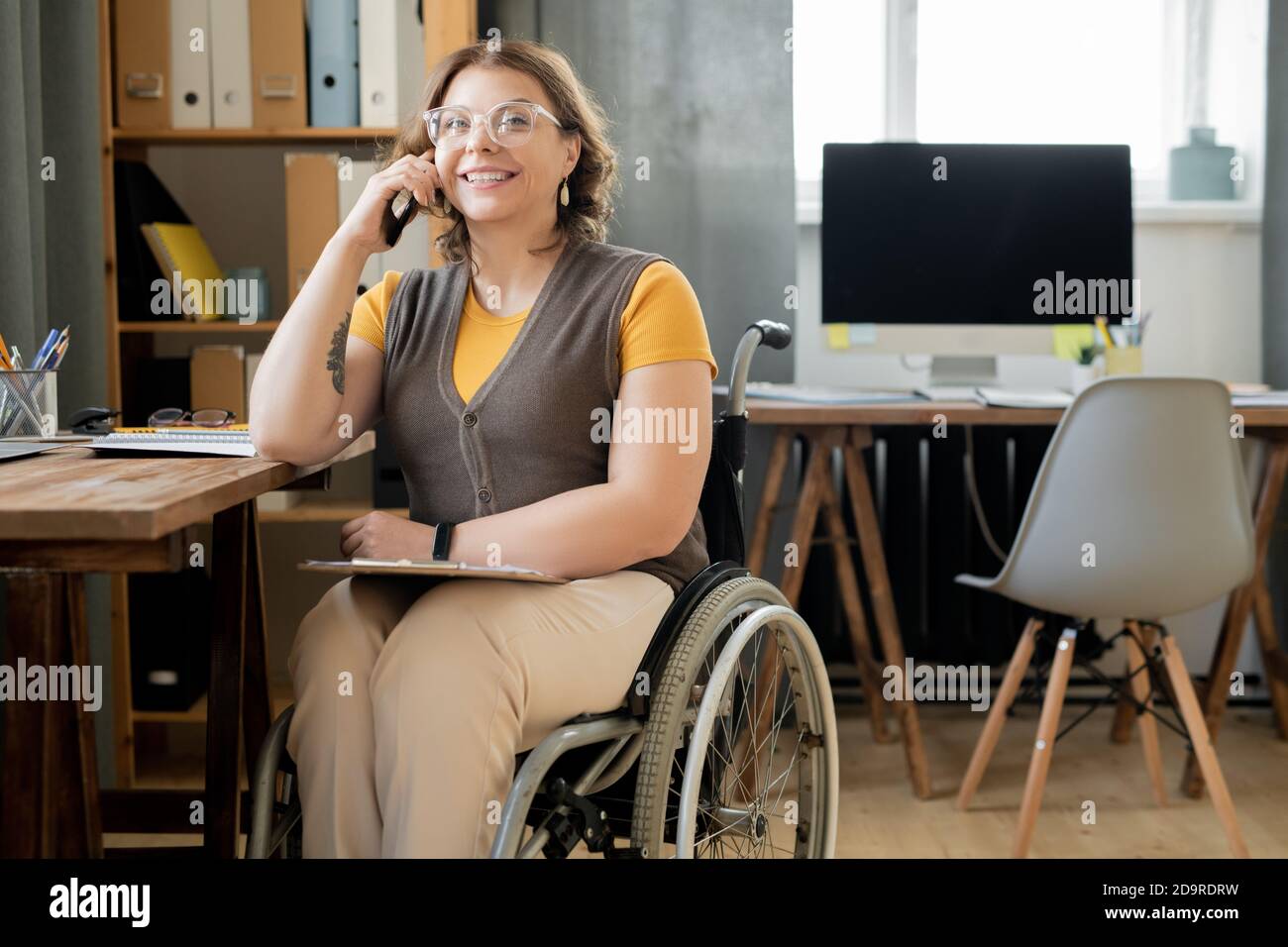 Female secretary wheelchair hi-res stock photography and images - Alamy