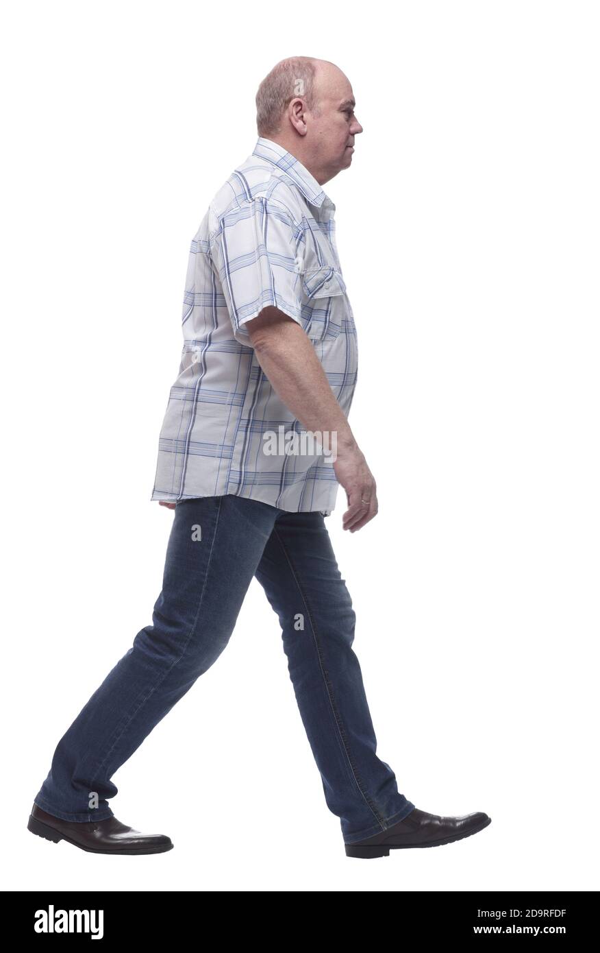 side view. smiling casual man confidently striding forward Stock Photo ...