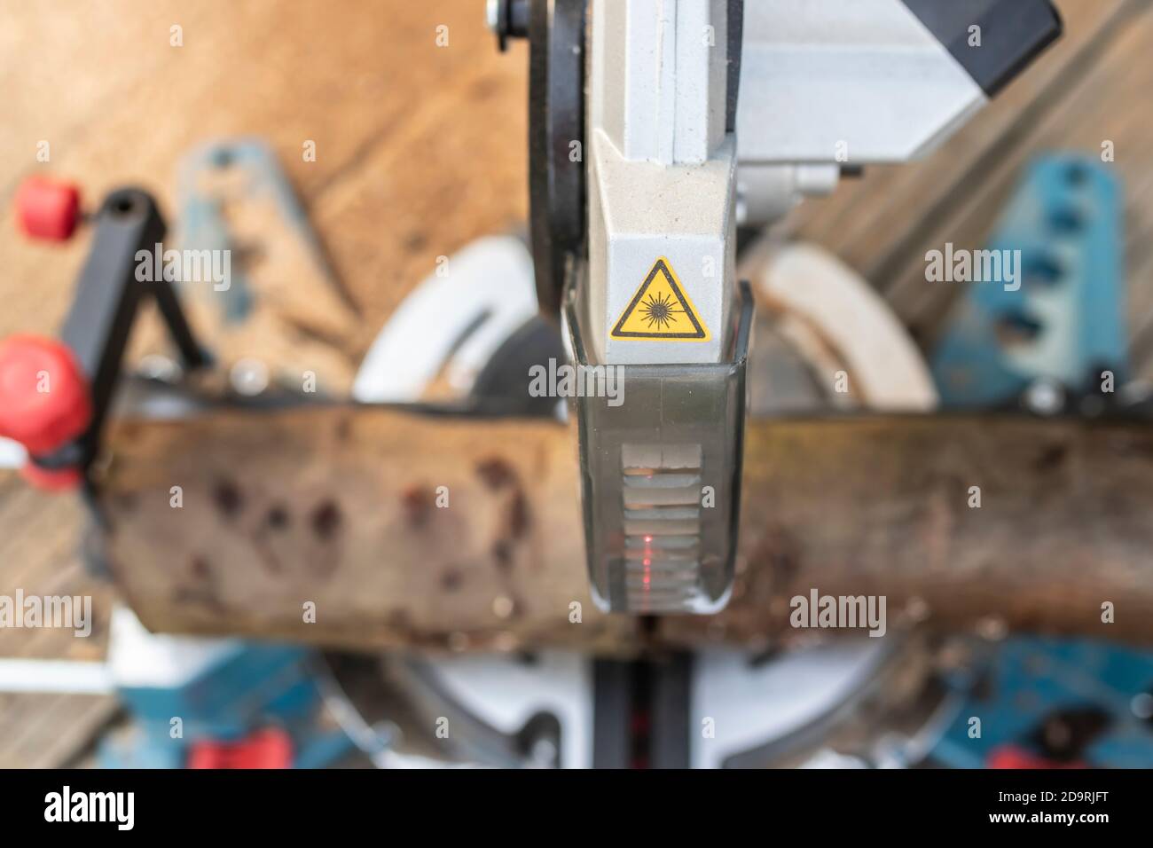 Erbauer mitre saw chopping logs for firewood Stock Photo - Alamy