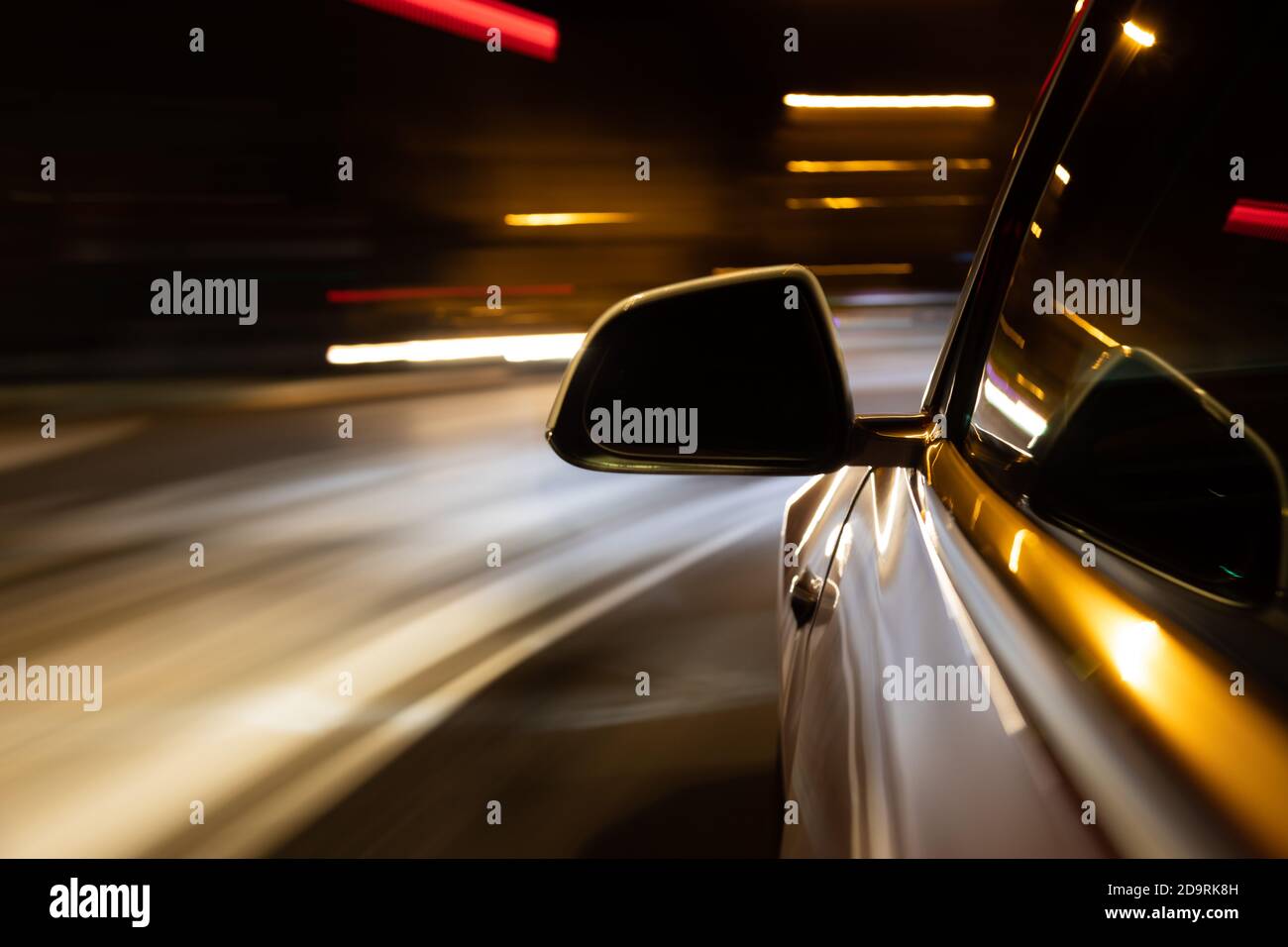 Car light trail while driving in the coty by night Stock Photo - Alamy