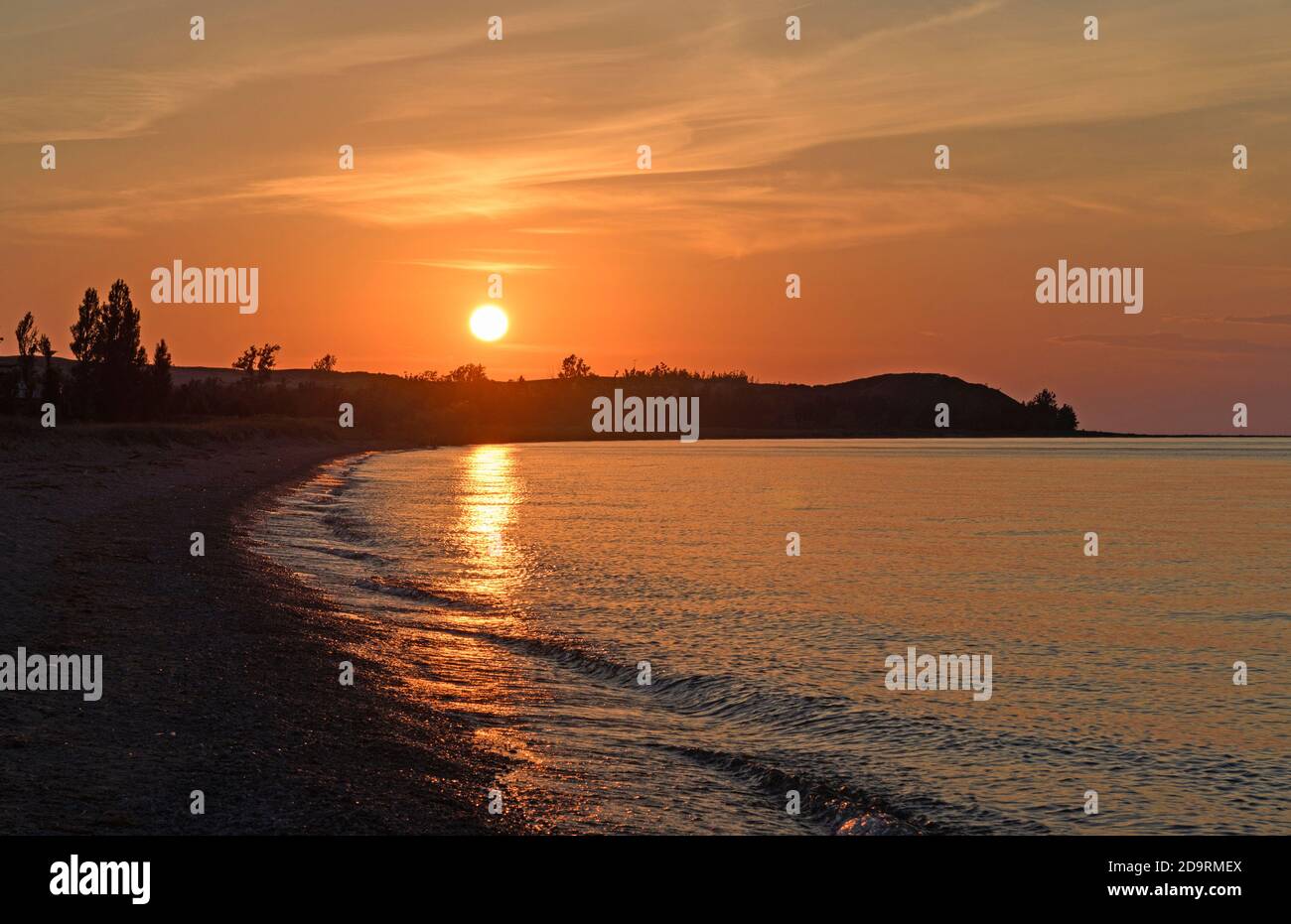 Sun Setting Over a Remote Shore in Sleeping Bear Dunes National ...