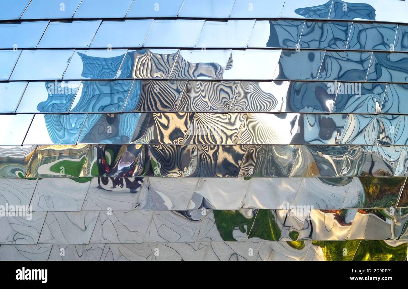 optical reflection on the metal facade of a modern building forming ...