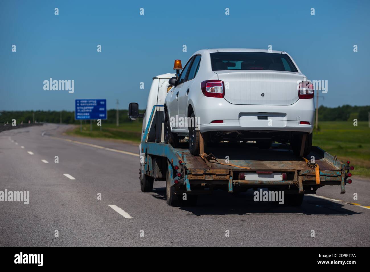 Truck carrying a car. Assistance on roads. Evacuation, emergency Stock ...
